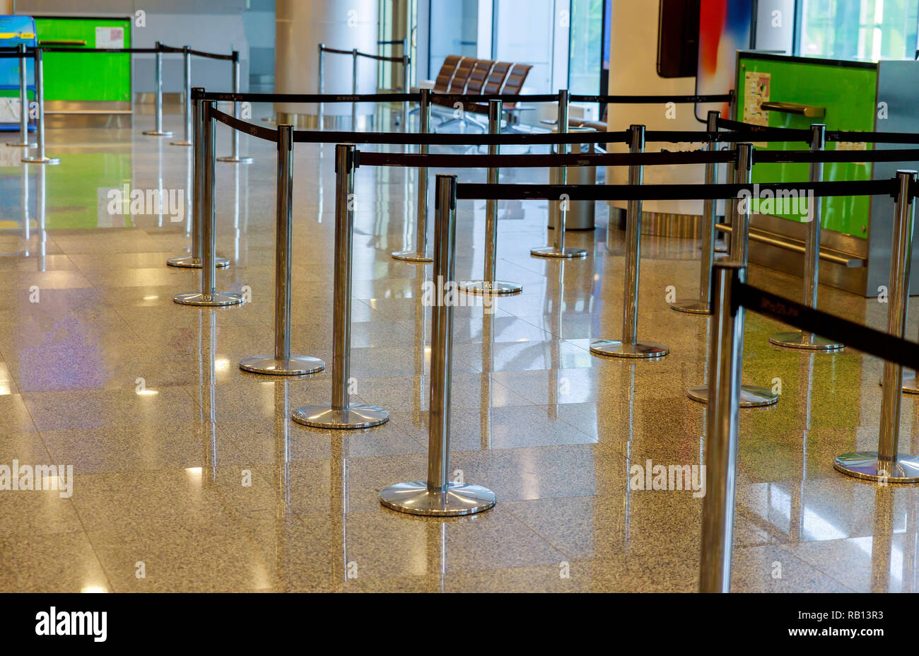 Interior with empty check-in lines on airport row of empty in airport ...