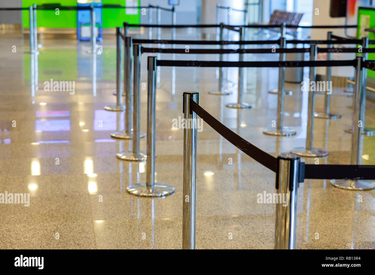 Row empty check-in desks in international airport, waiting area in ...