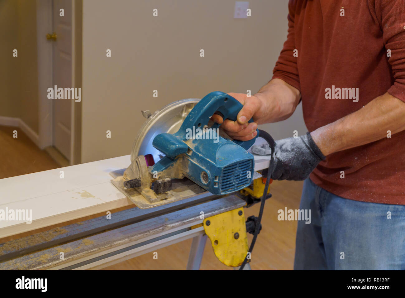 Carpenter using circular saw cutting boards with hand power tools Stock ...