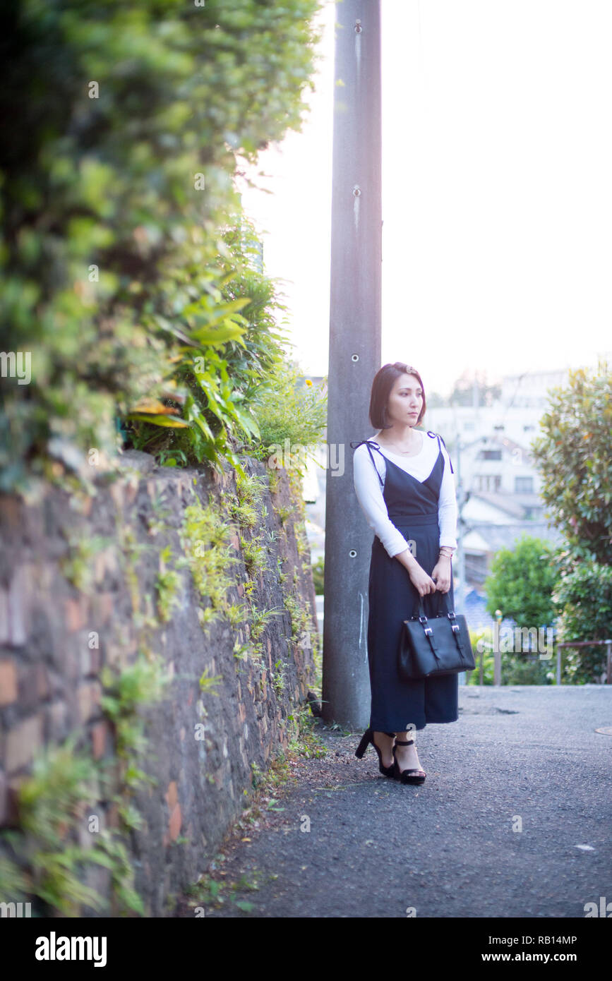 Japanese female model posing for the pictures on the street of Tokyo ...
