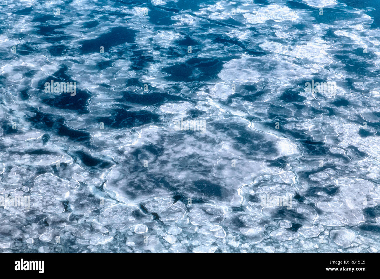 Blue sea surface with thin ice texture, background Stock Photo - Alamy