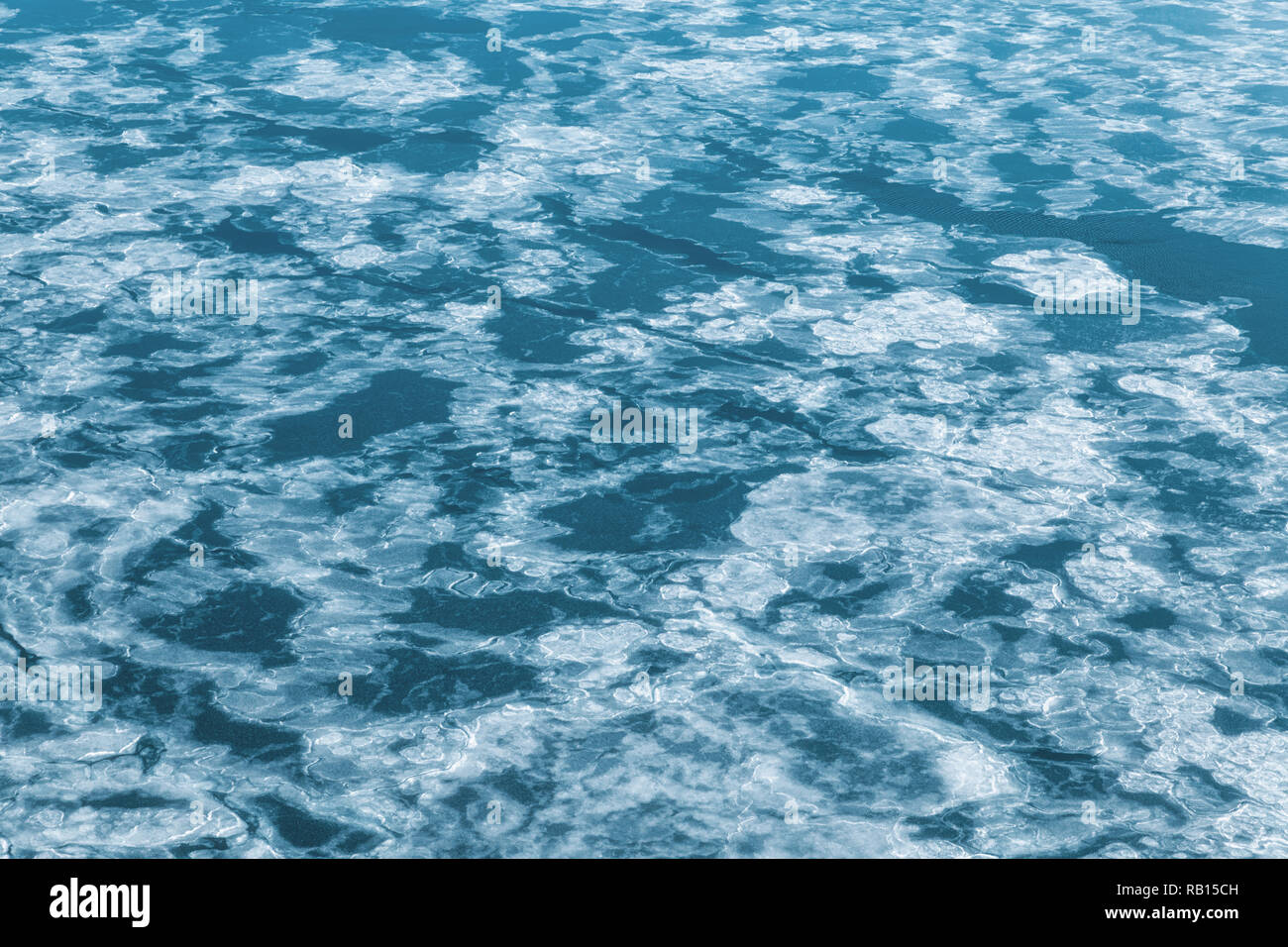 Blue sea surface with thin ice texture, background Stock Photo - Alamy