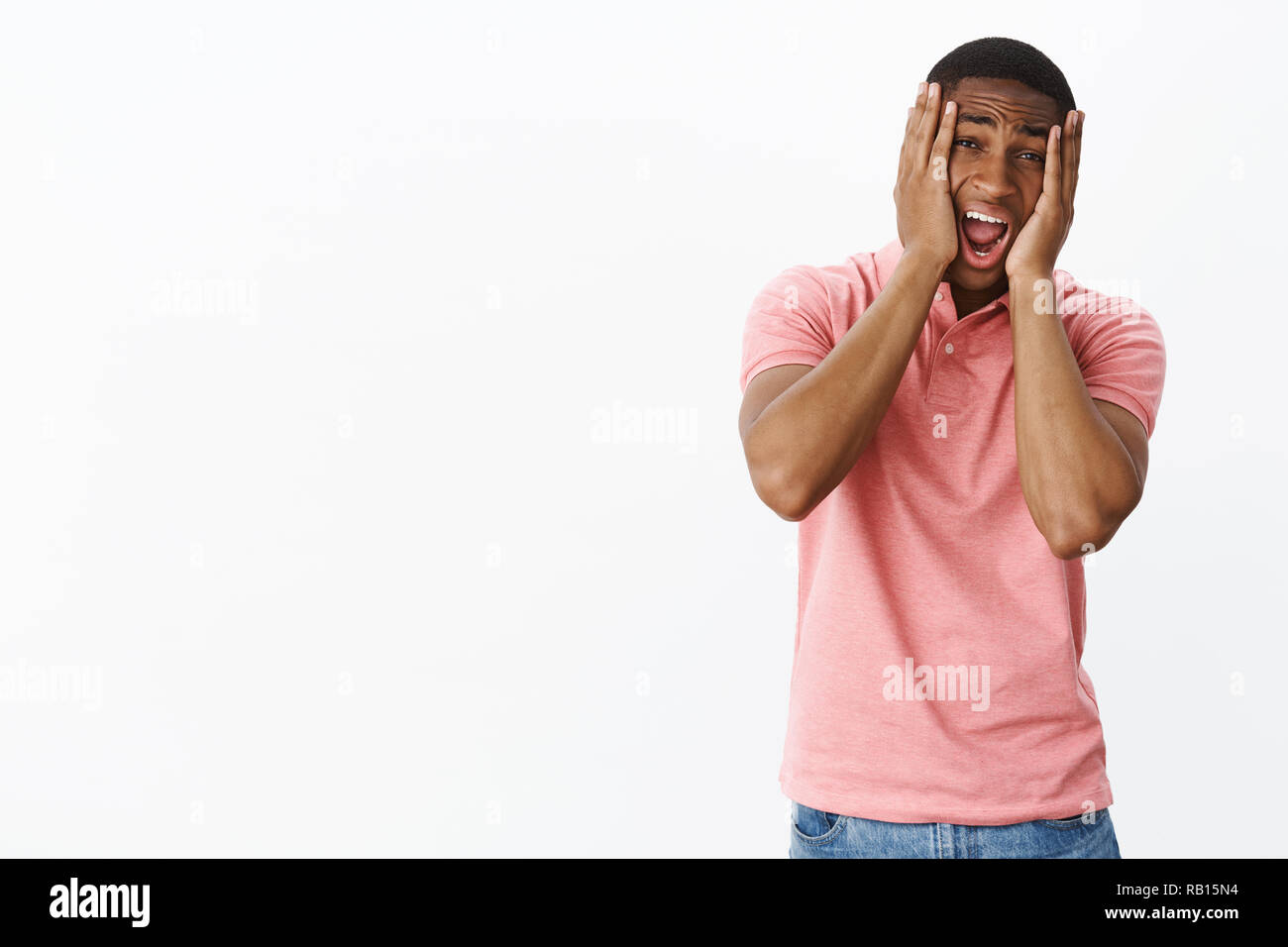 Waist-up shot of nervous and intense troubled african american handsome ...