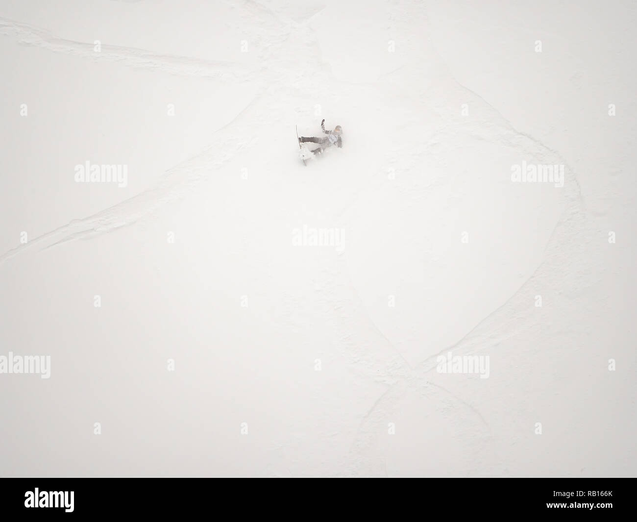 Freerider snowboarder lost his balance and fell into the snow during ...