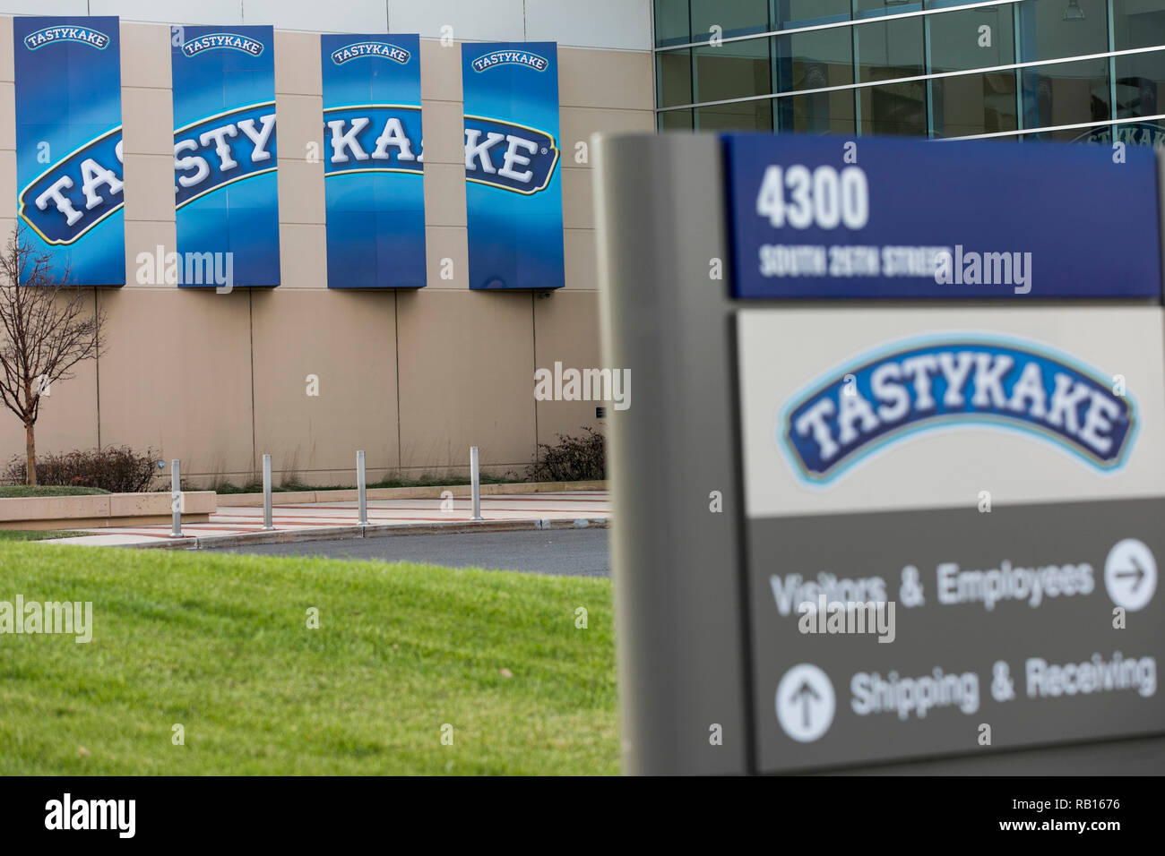 A logo sign outside of the headquarters of the Tasty Baking Company ...