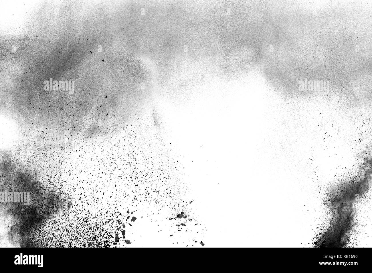 Closeup of black dust particles explode isolated on white background ...