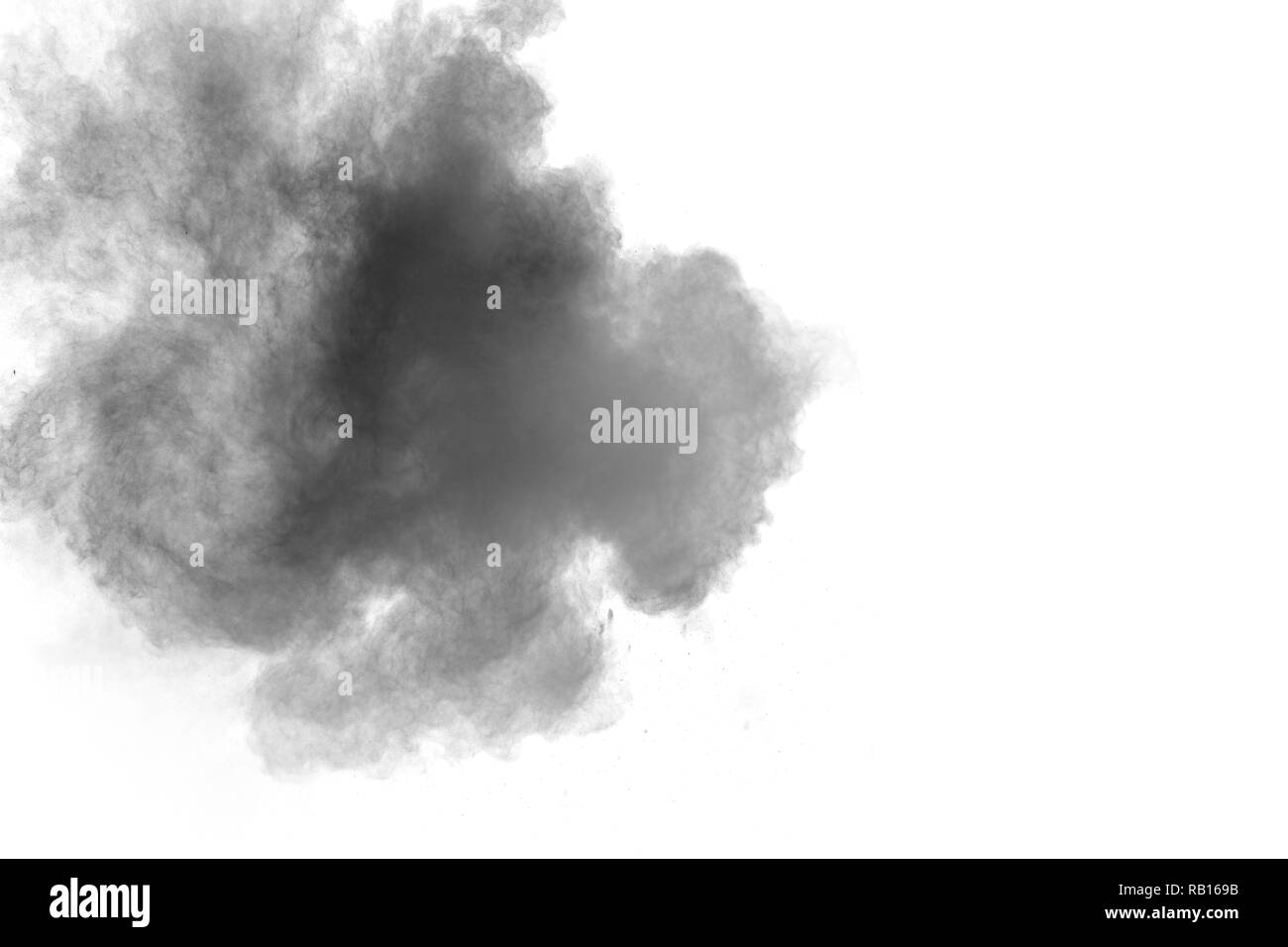 Closeup of black dust particles explode isolated on white background ...