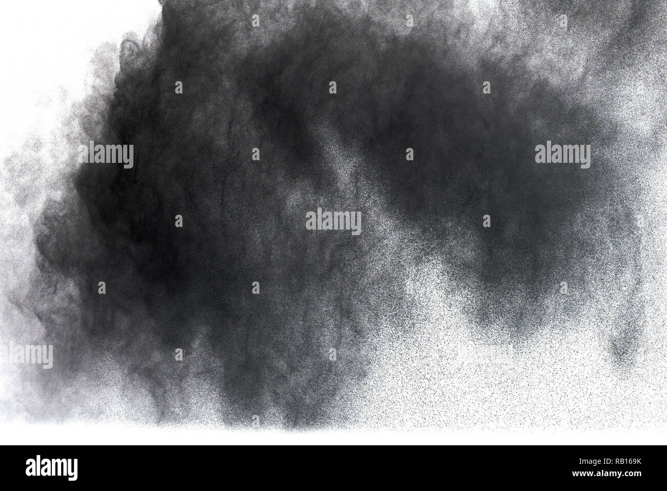 Closeup of black dust particles explode isolated on white background ...
