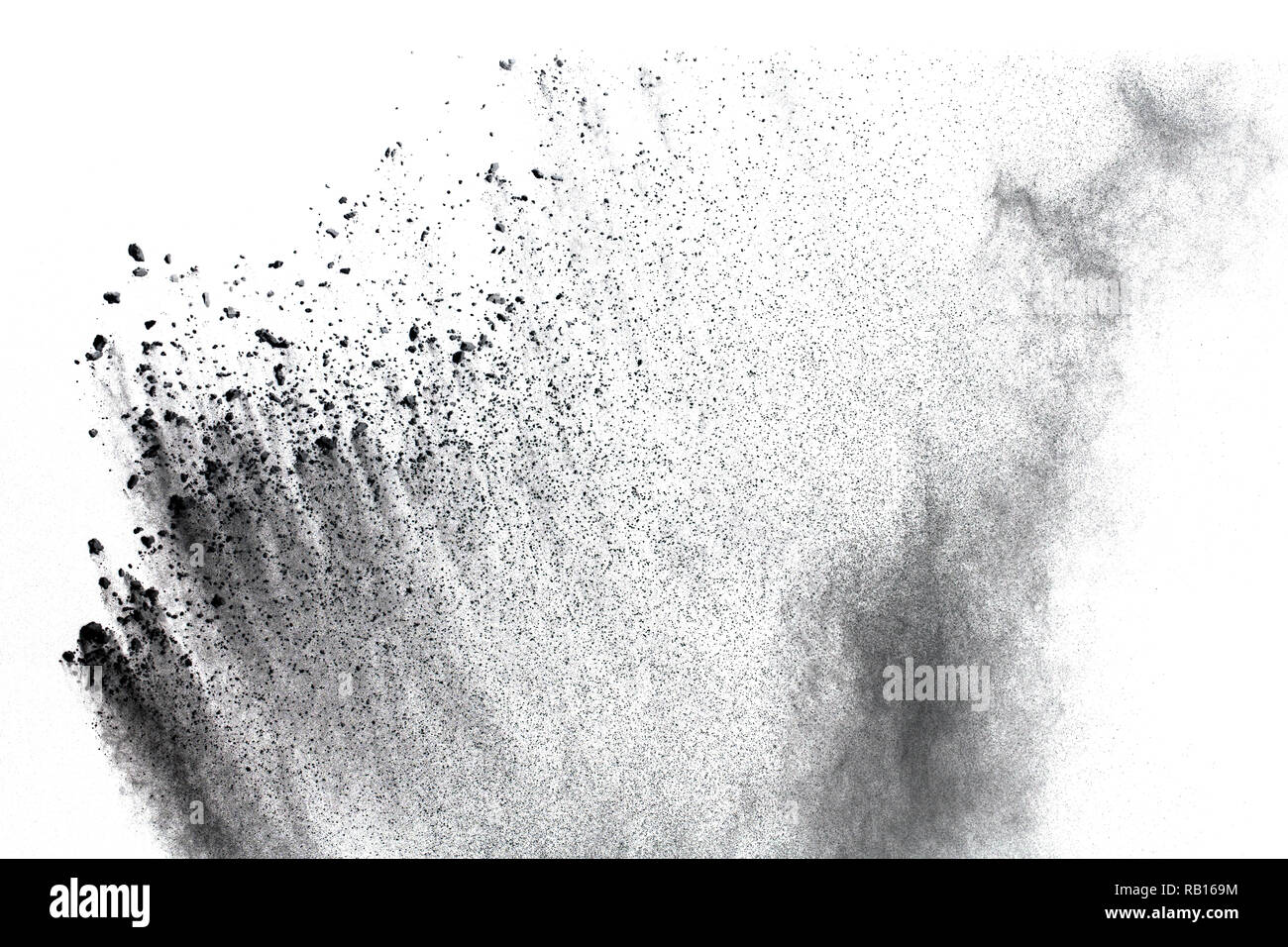 Closeup of black dust particles explode isolated on white background ...