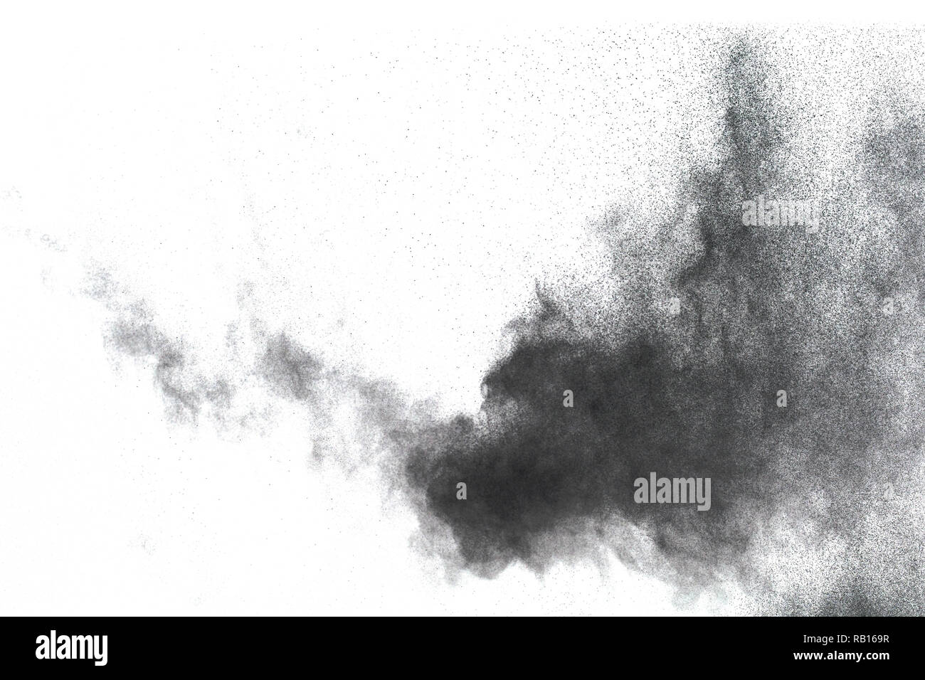 Closeup of black dust particles explode isolated on white background ...