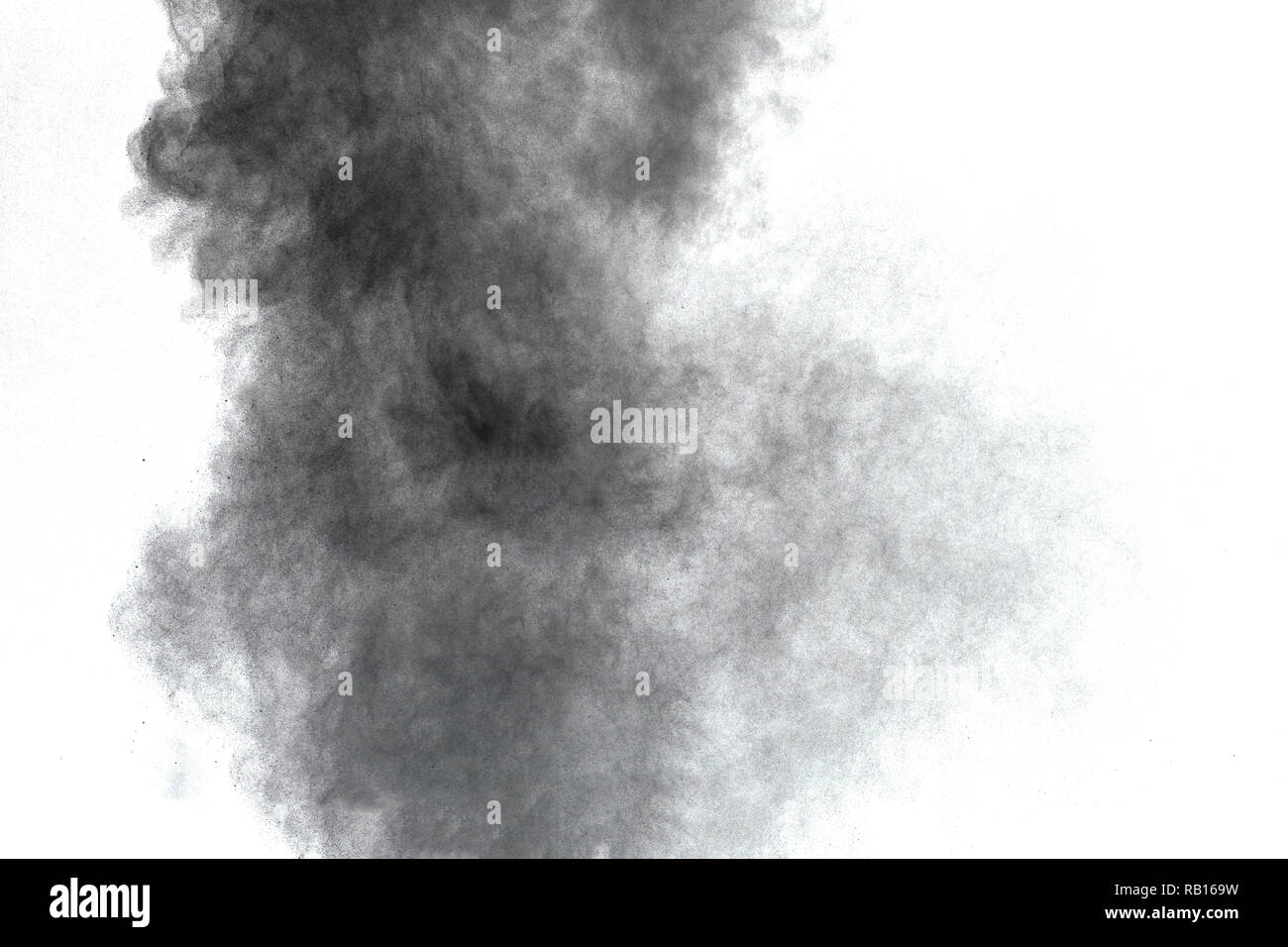 Closeup of black dust particles explode isolated on white background ...