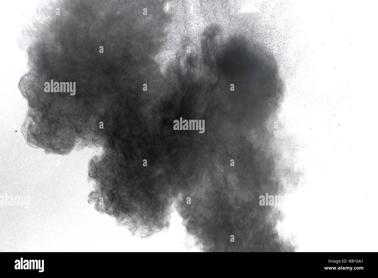Closeup of black dust particles explode isolated on white background ...