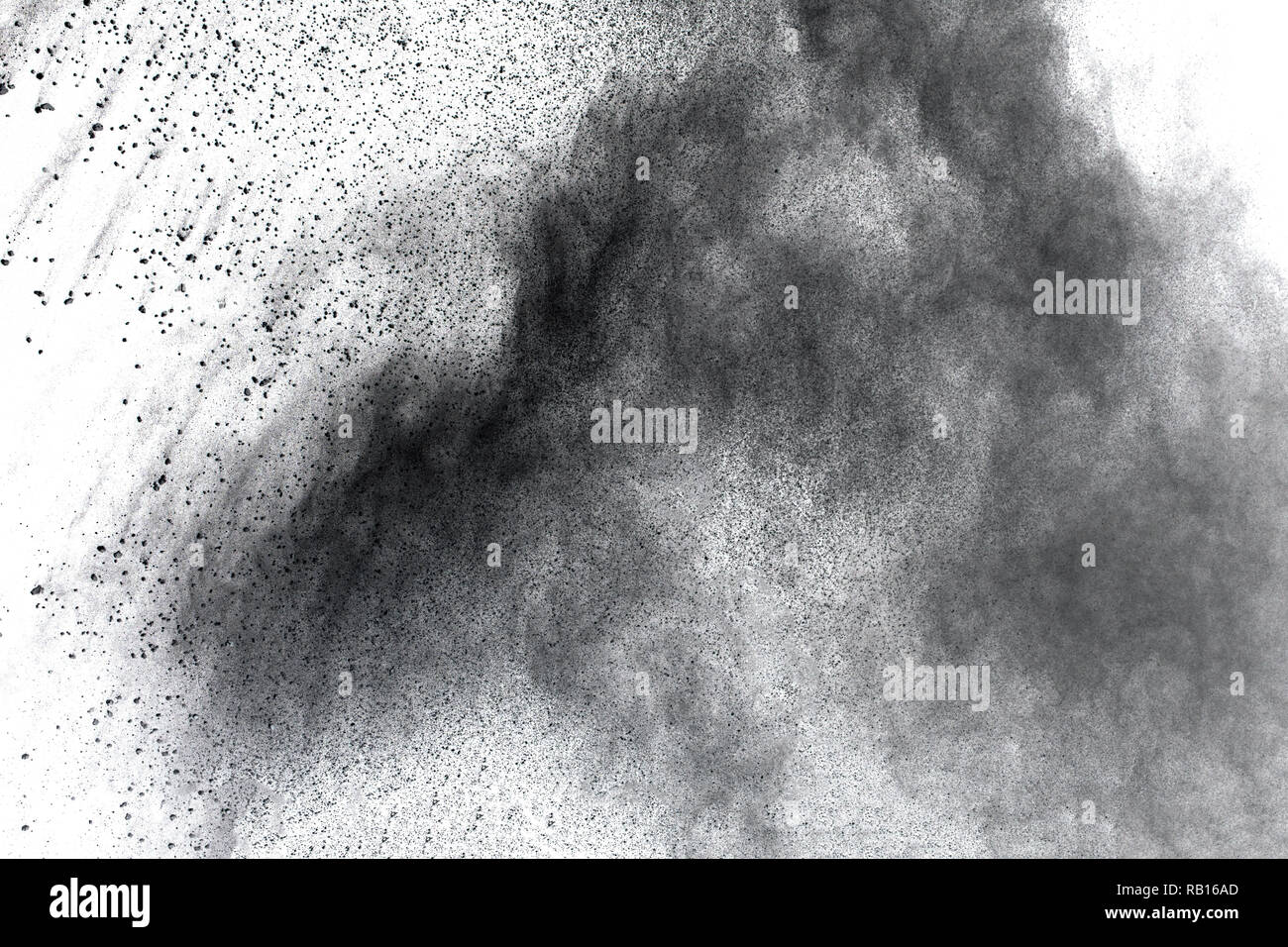 Closeup of black dust particles explode isolated on white background ...