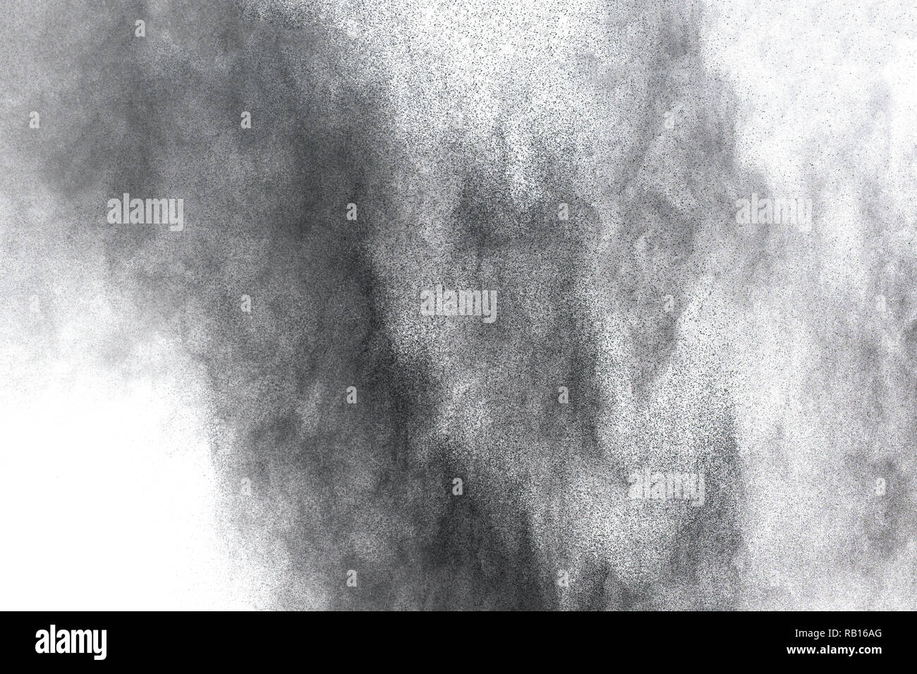 Closeup of black dust particles explode isolated on white background ...