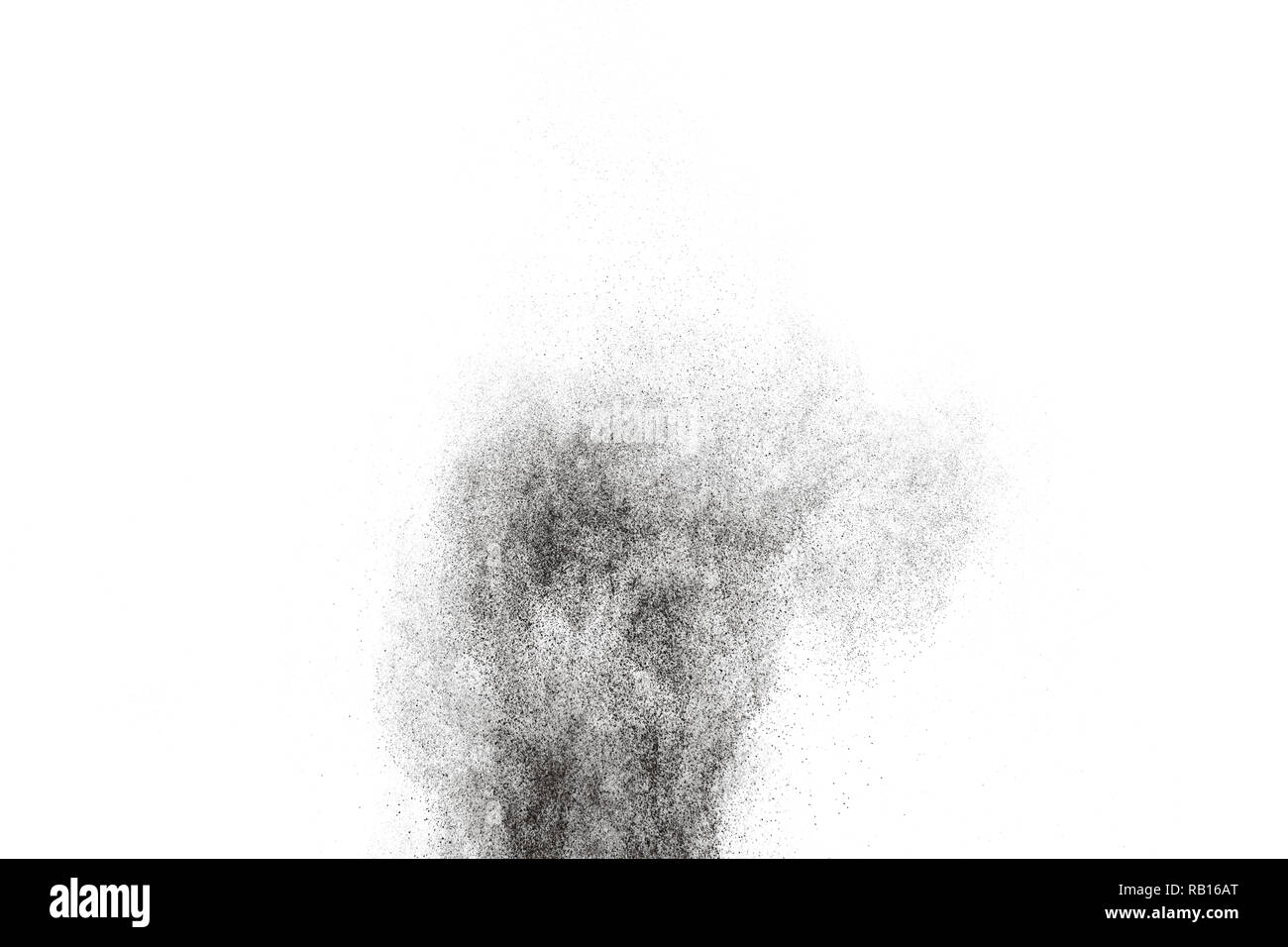 Closeup of black dust particles explode isolated on white background ...
