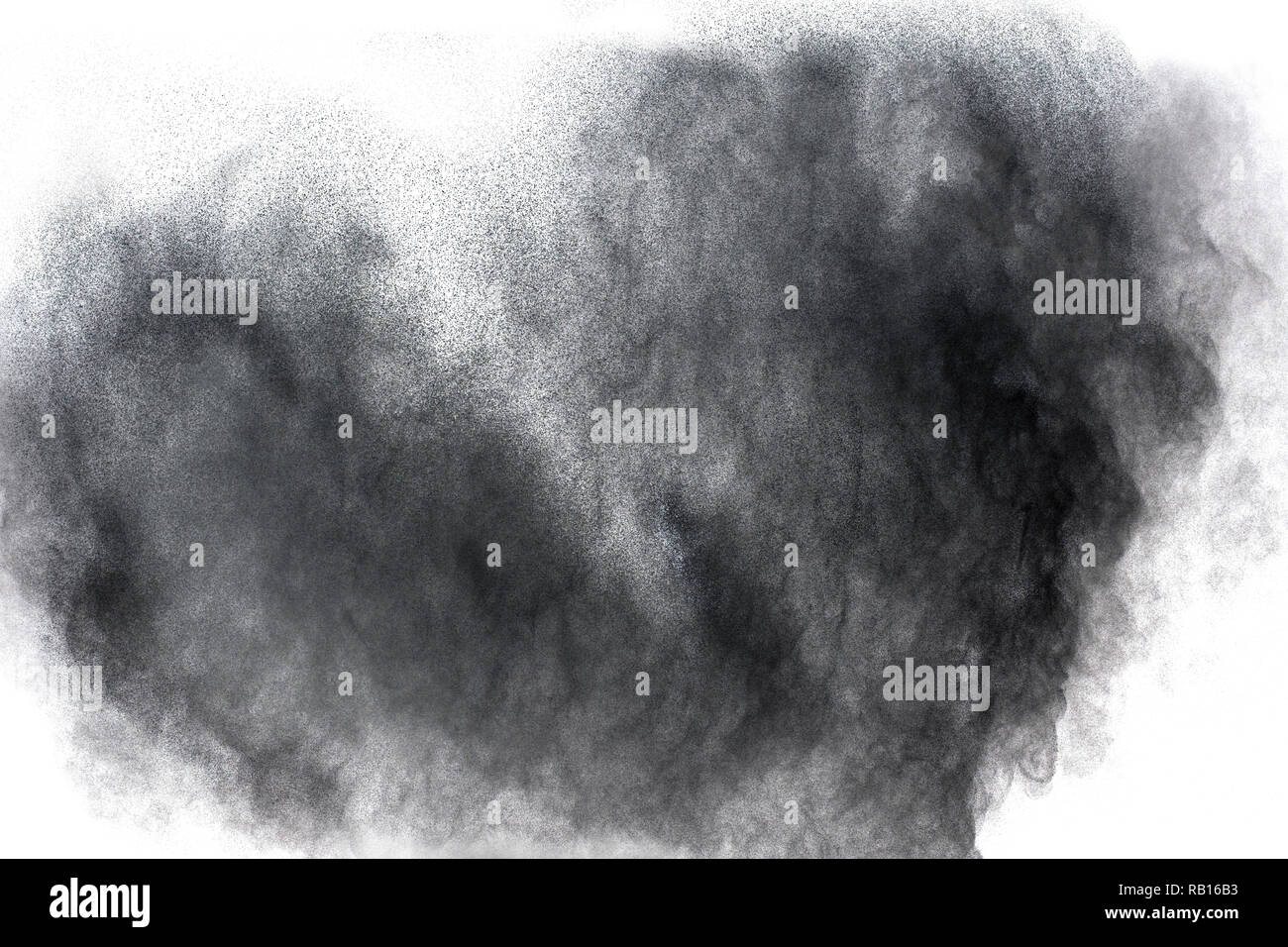 Closeup of black dust particles explode isolated on white background ...