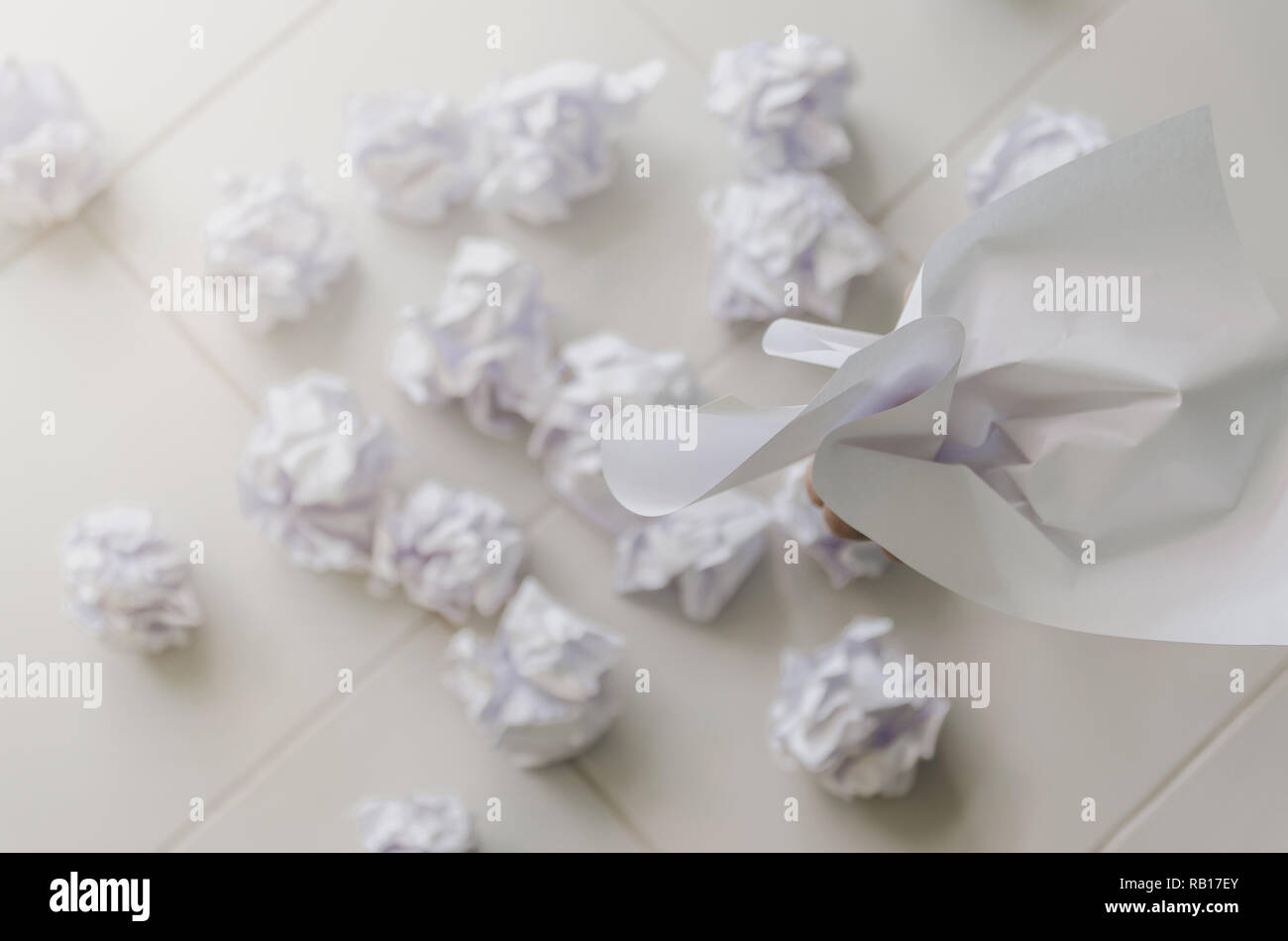 No idea and fail concept - Human hand holding crumpled paper or trash ...