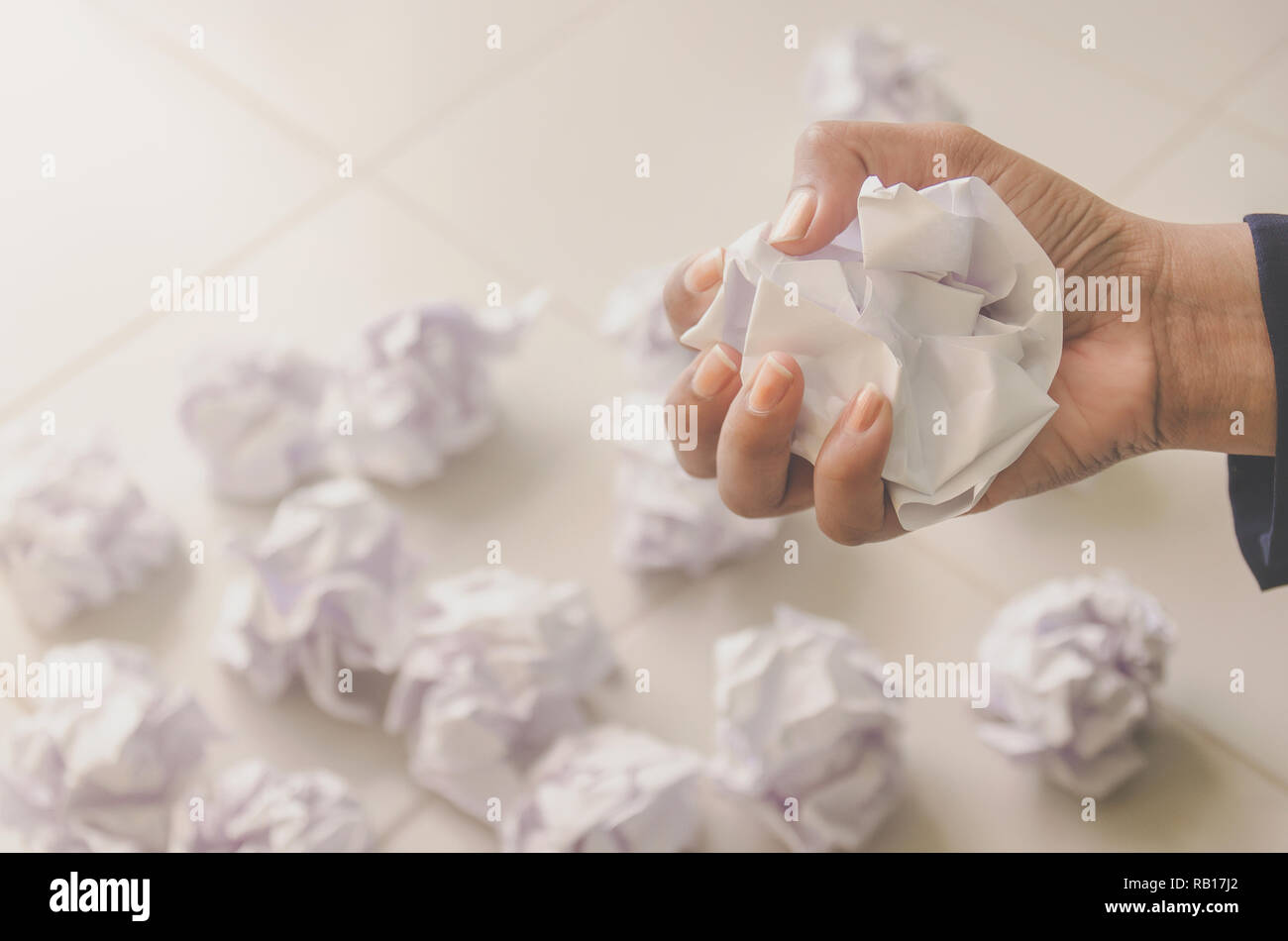 No idea and fail concept - Human hand holding crumpled paper or trash ...