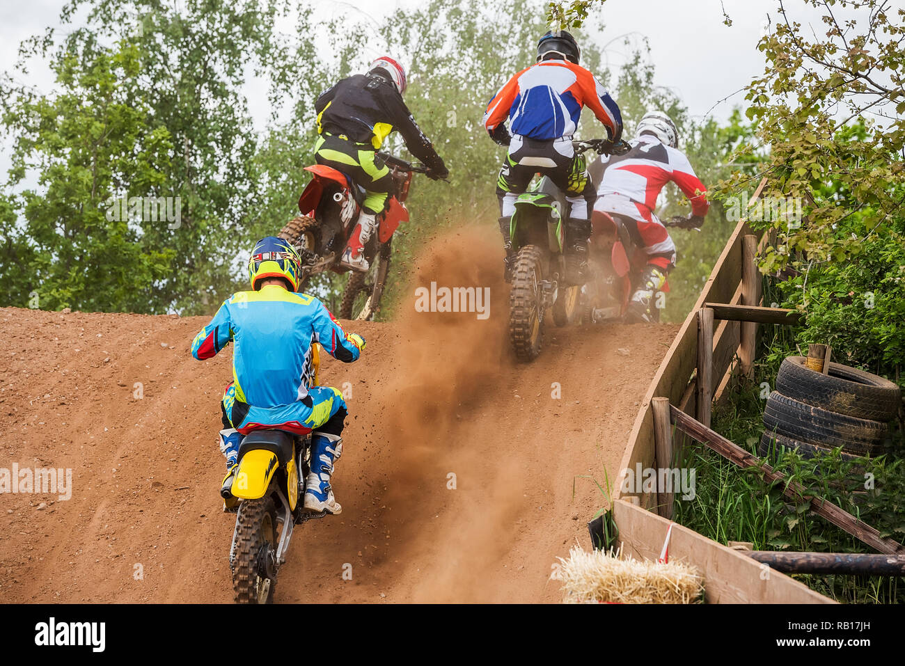 motocross racer jumping on the track Stock Photo - Alamy