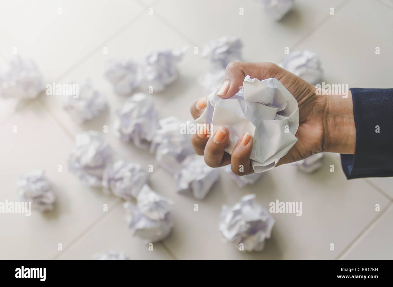 No idea and fail concept - Human hand holding crumpled paper or trash ...