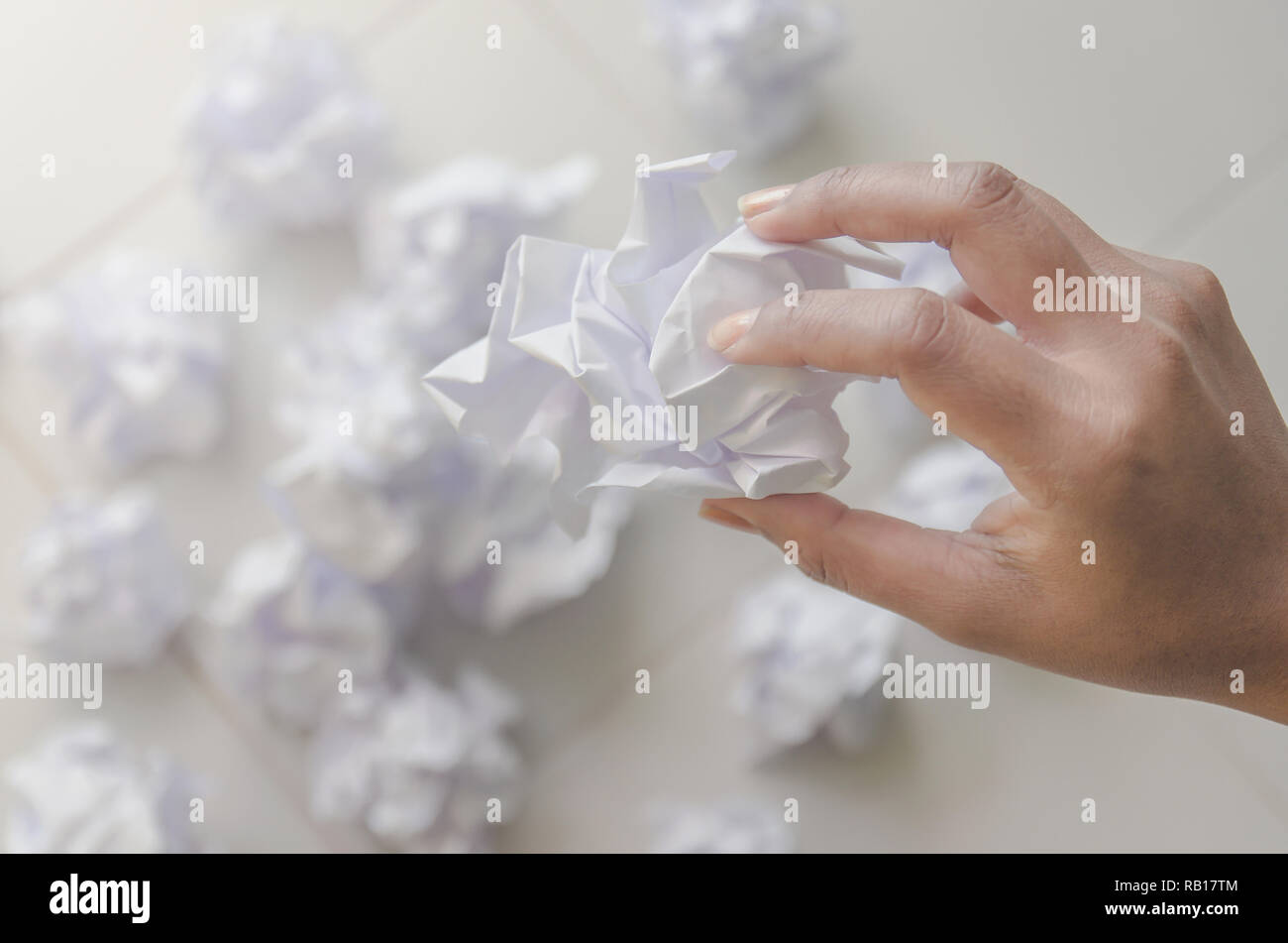 Hand crumpling paper hi-res stock photography and images - Alamy
