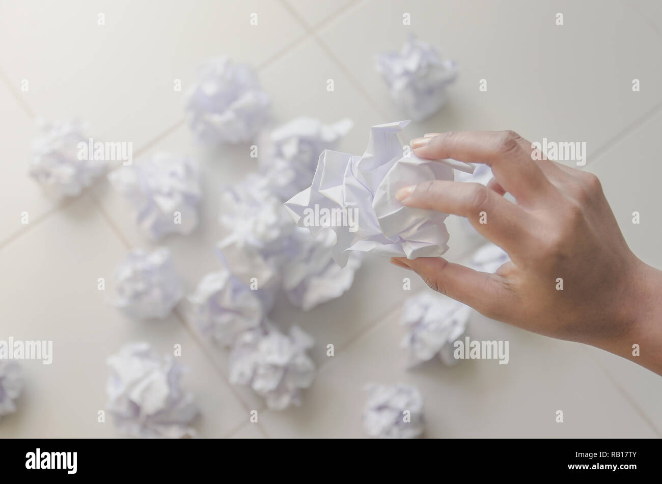 No idea and fail concept - Human hand holding crumpled paper or trash ...