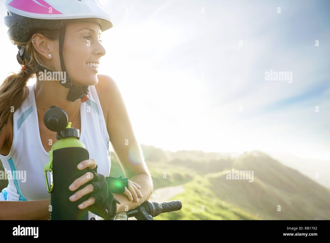 Girl riding bike drinking water hi-res stock photography and images - Alamy