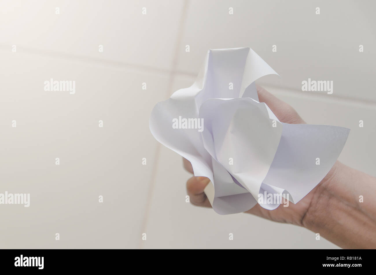 No idea and fail concept - Human hand holding crumpled paper or trash ...