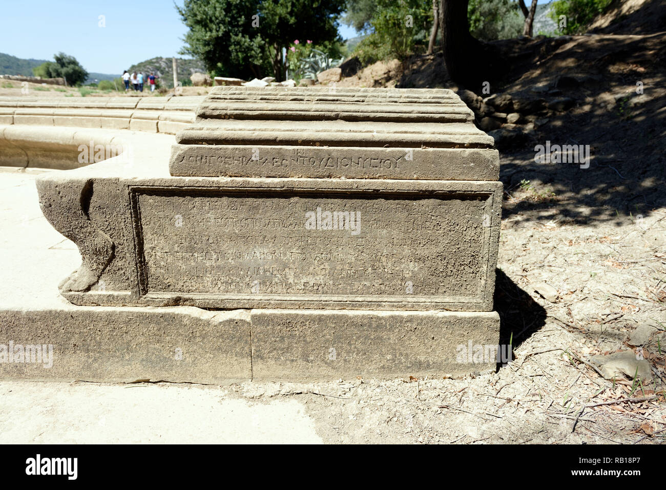 Ancient Greek inscriptions cover the sides and rear of the Exedra at ...