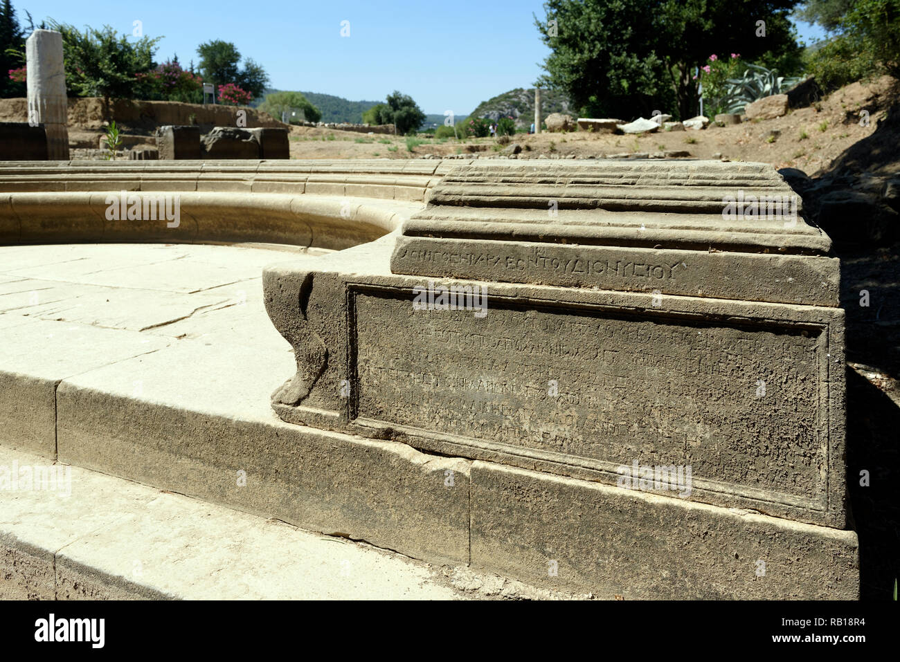 Ancient Greek inscriptions cover the sides and rear of the Exedra at ...