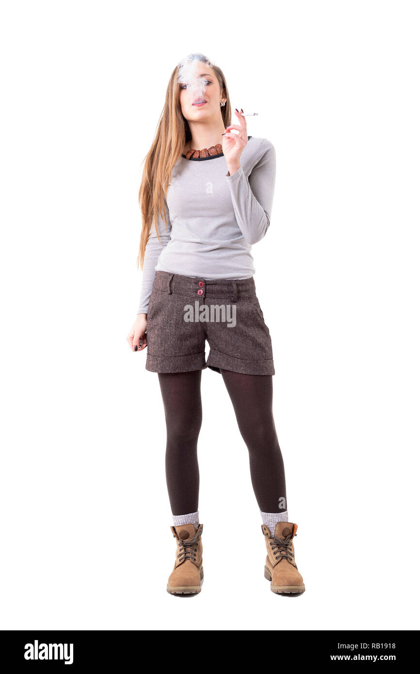 Stylish authentic hipster woman smoking rolled cigarette. Full body ...
