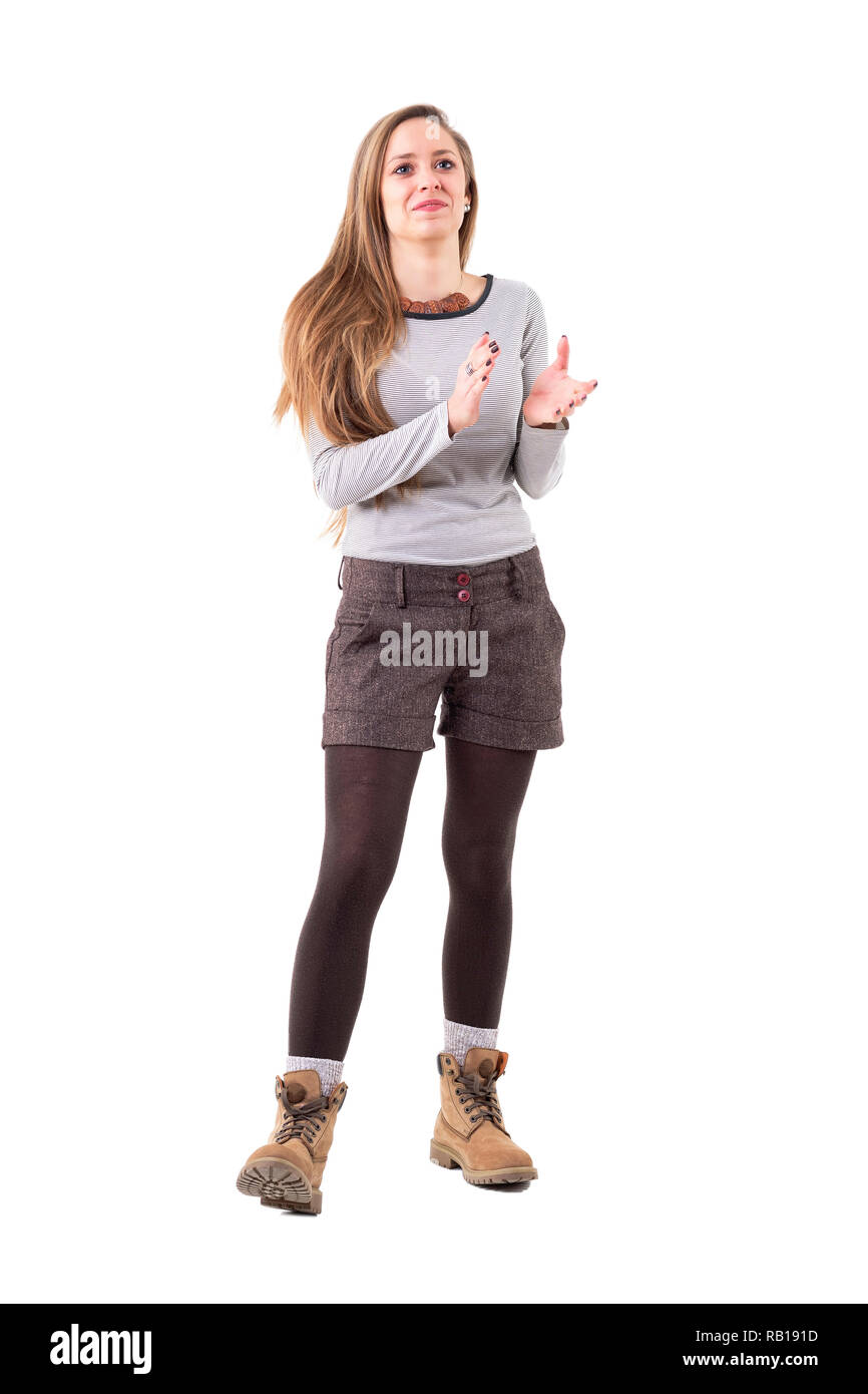 Happy young stylish hipster woman cheering and applauding. Full body ...