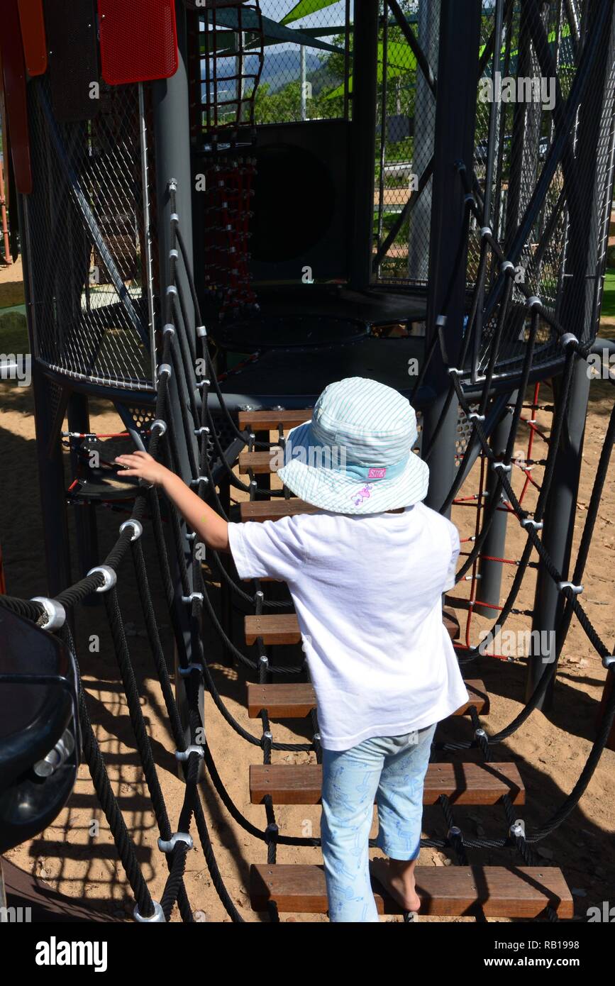 A young girl plays on a new playground, Wadda Mooli Park Playground ...