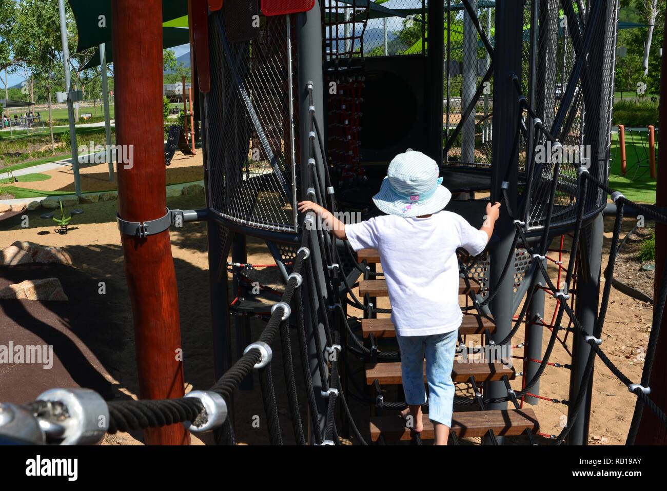A young girl plays on a new playground, Wadda Mooli Park Playground ...