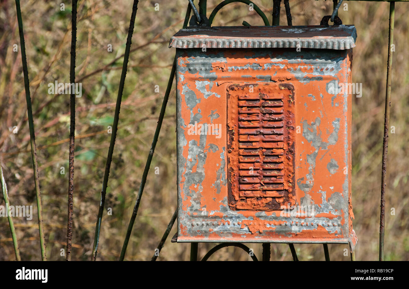 Old weathered grunge rural corroded metal post box on iron garden door ...