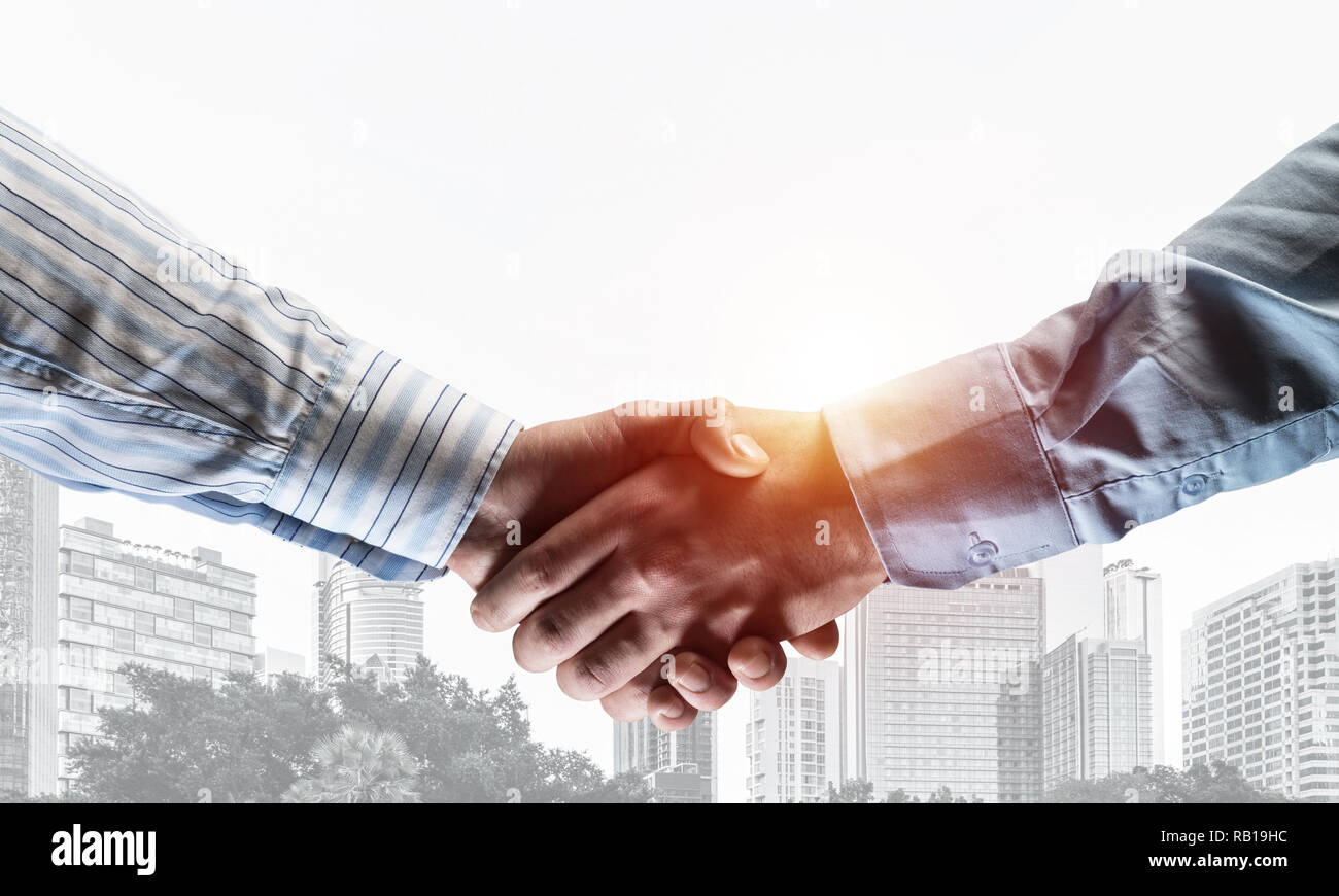 Business handshake as idea for unity and cooperation or greeting Stock ...