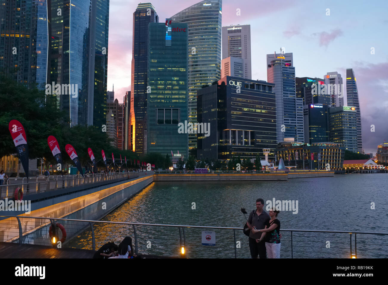 Tourists enjoying the scenery during sunset & taking selfies at Marina ...