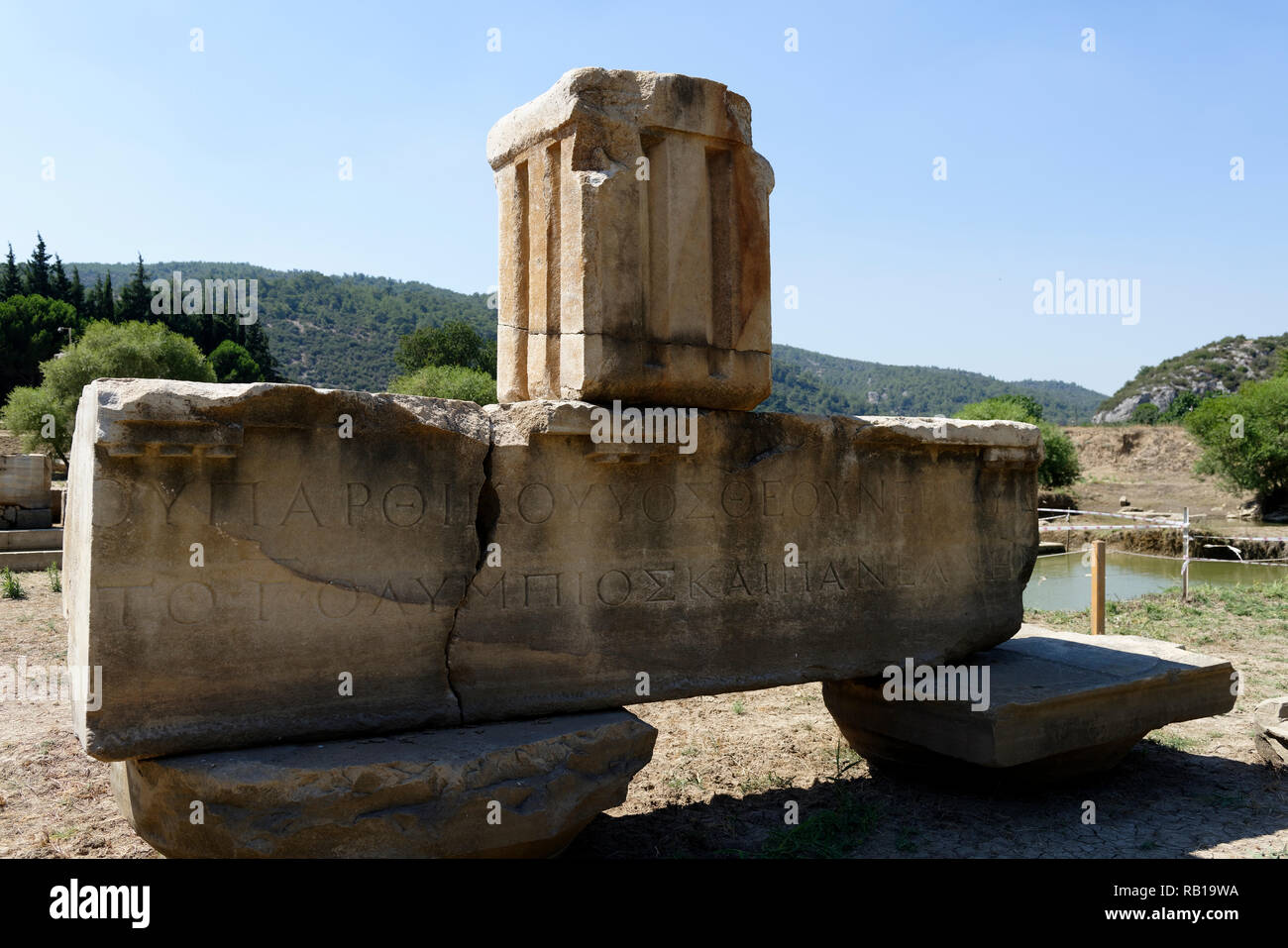 Ancient Greek text inscriptions on a large fragment of stone artefact ...