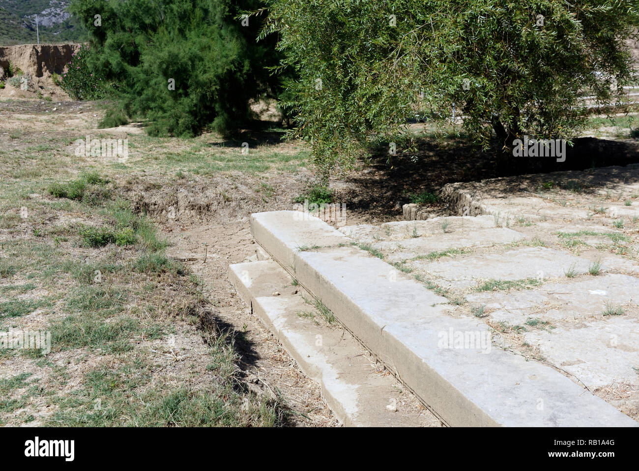 Part view of the partly buried five step crepidoma of the Temple of ...