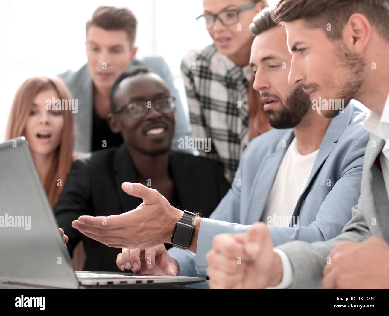 Businessman presenting to colleagues at a meeting Stock Photo - Alamy