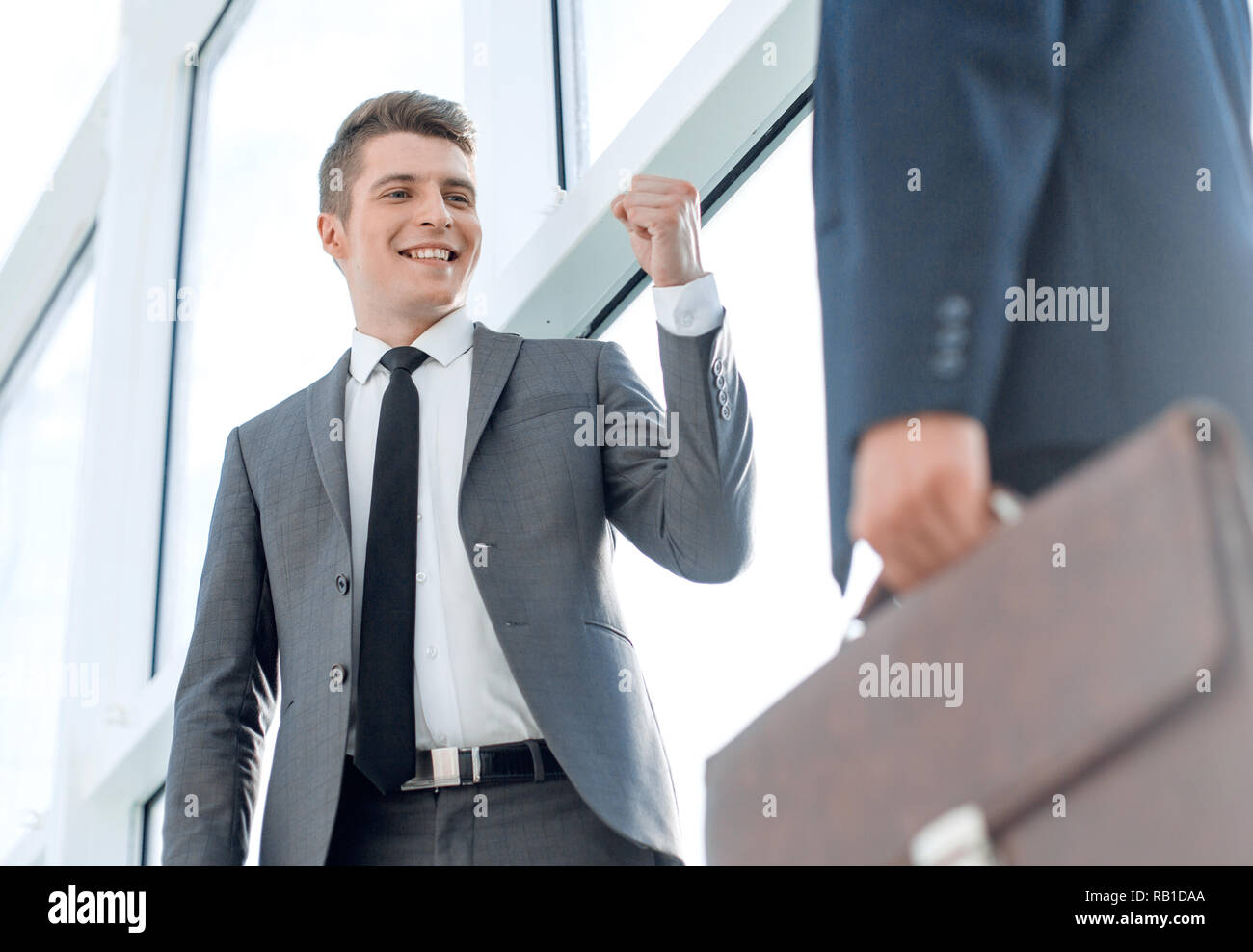 close up.business people standing near the office window Stock Photo ...