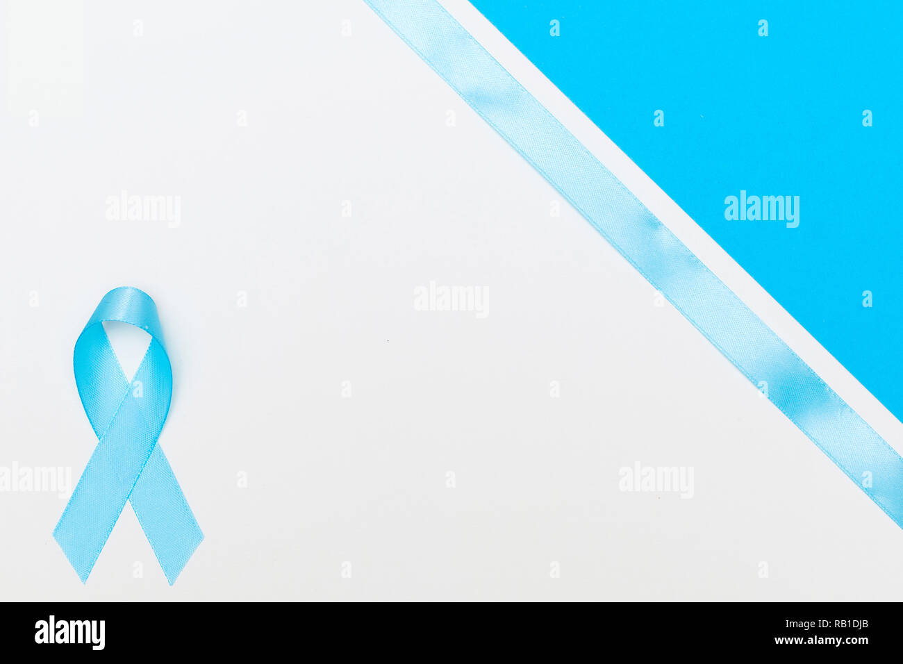 blue cancer awareness ribbon with trail on white background Stock Photo ...
