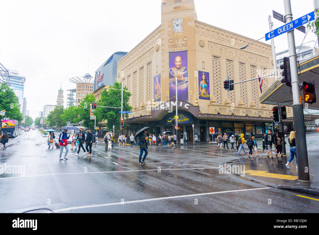 AUCKLAND NEW ZEALAND - DECEMBER 23 2018; People cross Queen Street and ...