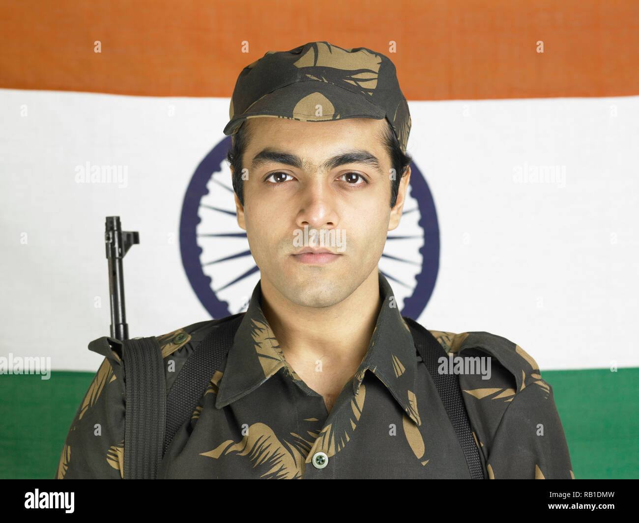 PORTRAIT OF INDIAN SOLDIER DRESSED IN UNIFORM WITH THE INDIAN NATIONAL ...