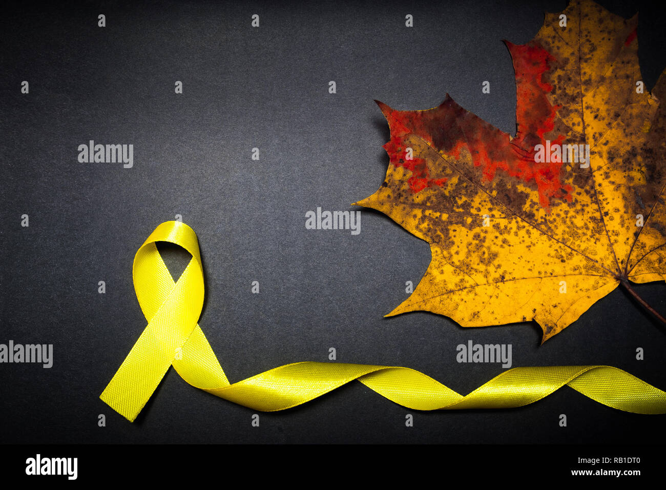 childhood cancer awareness day. Yellow ribbon on black background Stock ...