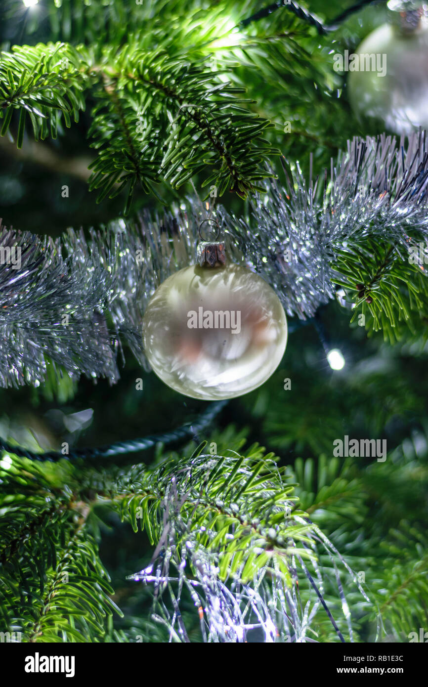 Christmas tree with ball and garland Stock Photo - Alamy