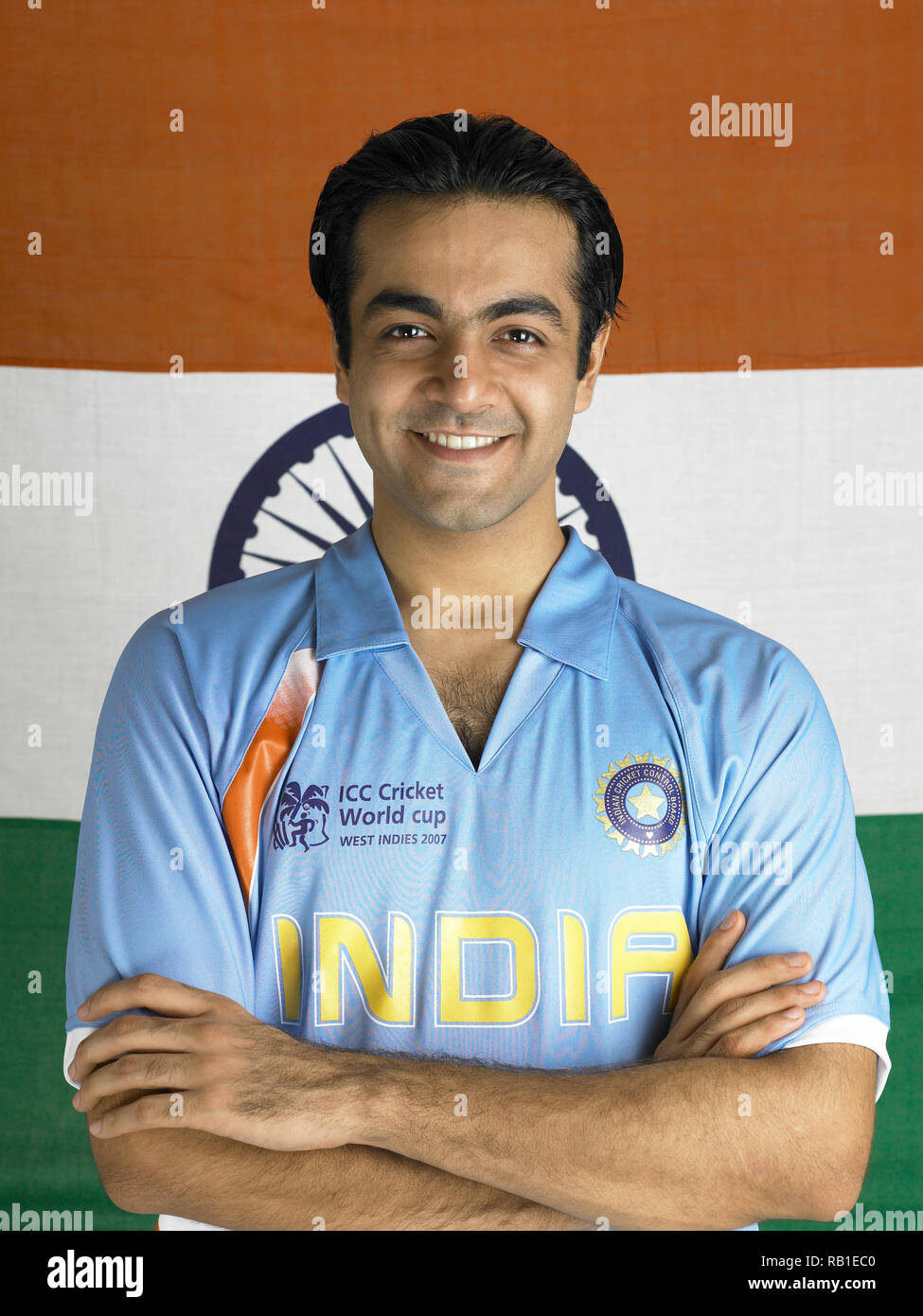 PORTRAIT OF A CRICKET PLAYER WITH THE INDIAN NATIONAL FLAG IN THE ...