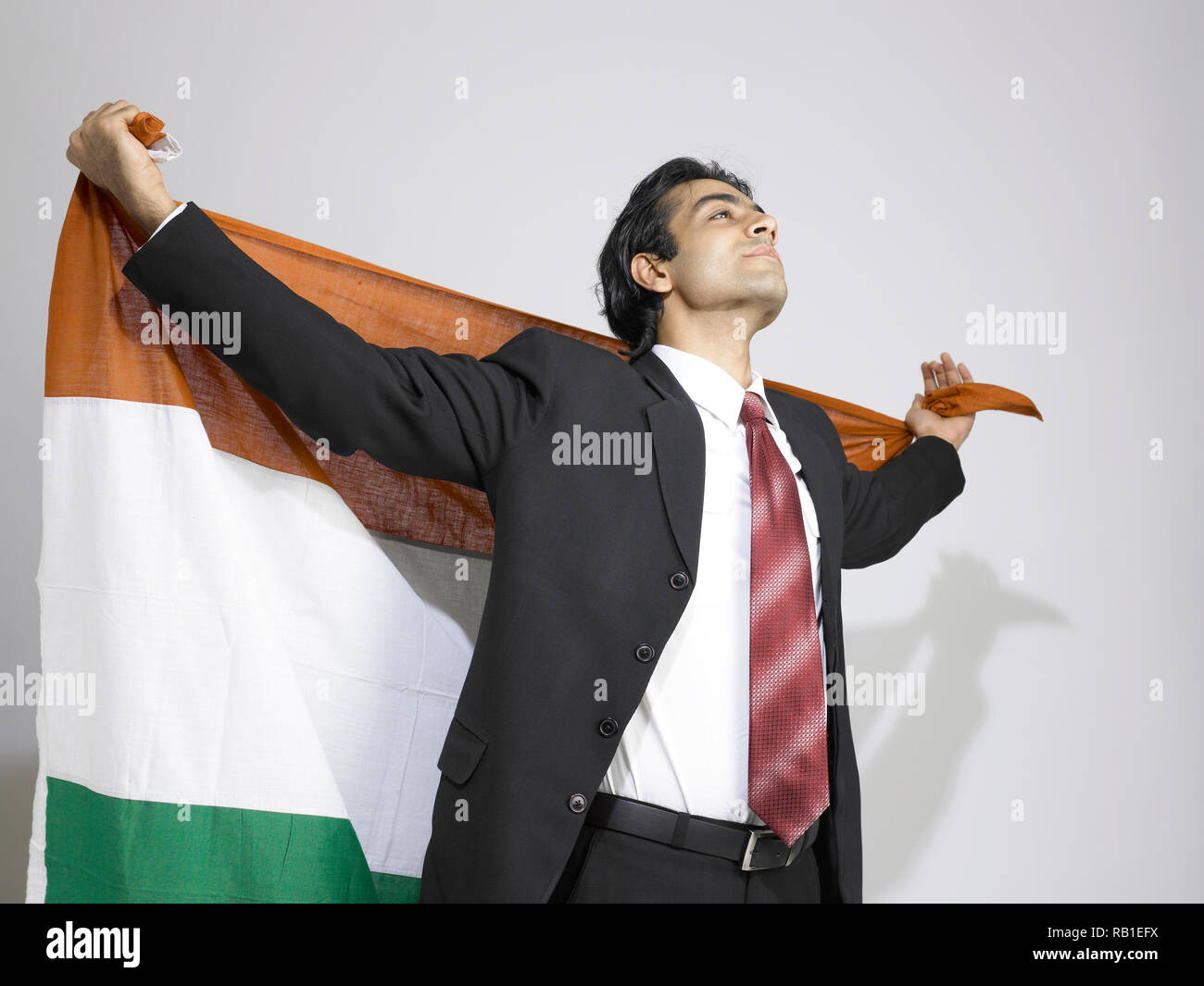 PORTRAIT OF A CORPORATE EXECUTIVE HOLDING THE INDIAN NATIONAL FLAG ...