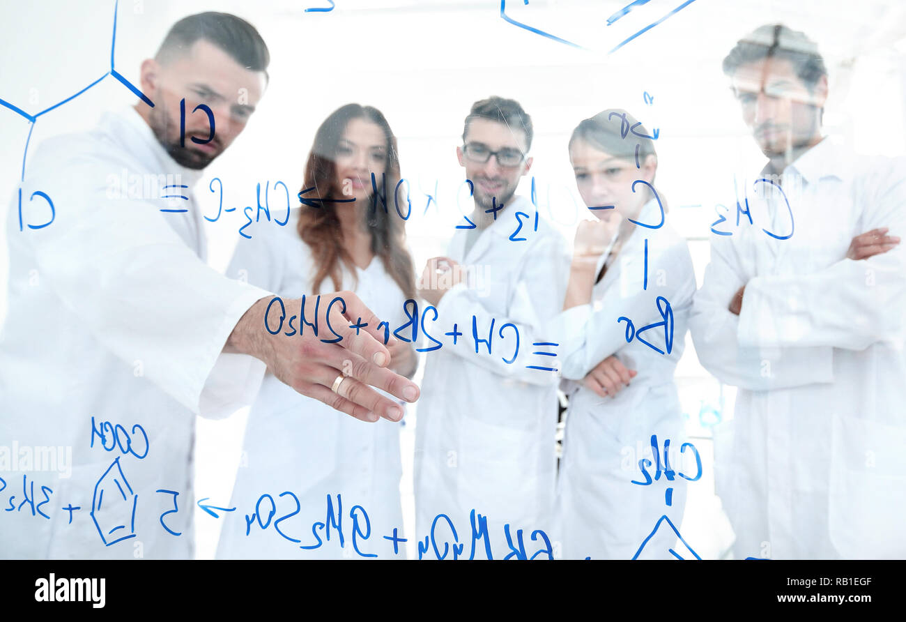 in the background image group laboratory scientists discussing their ...