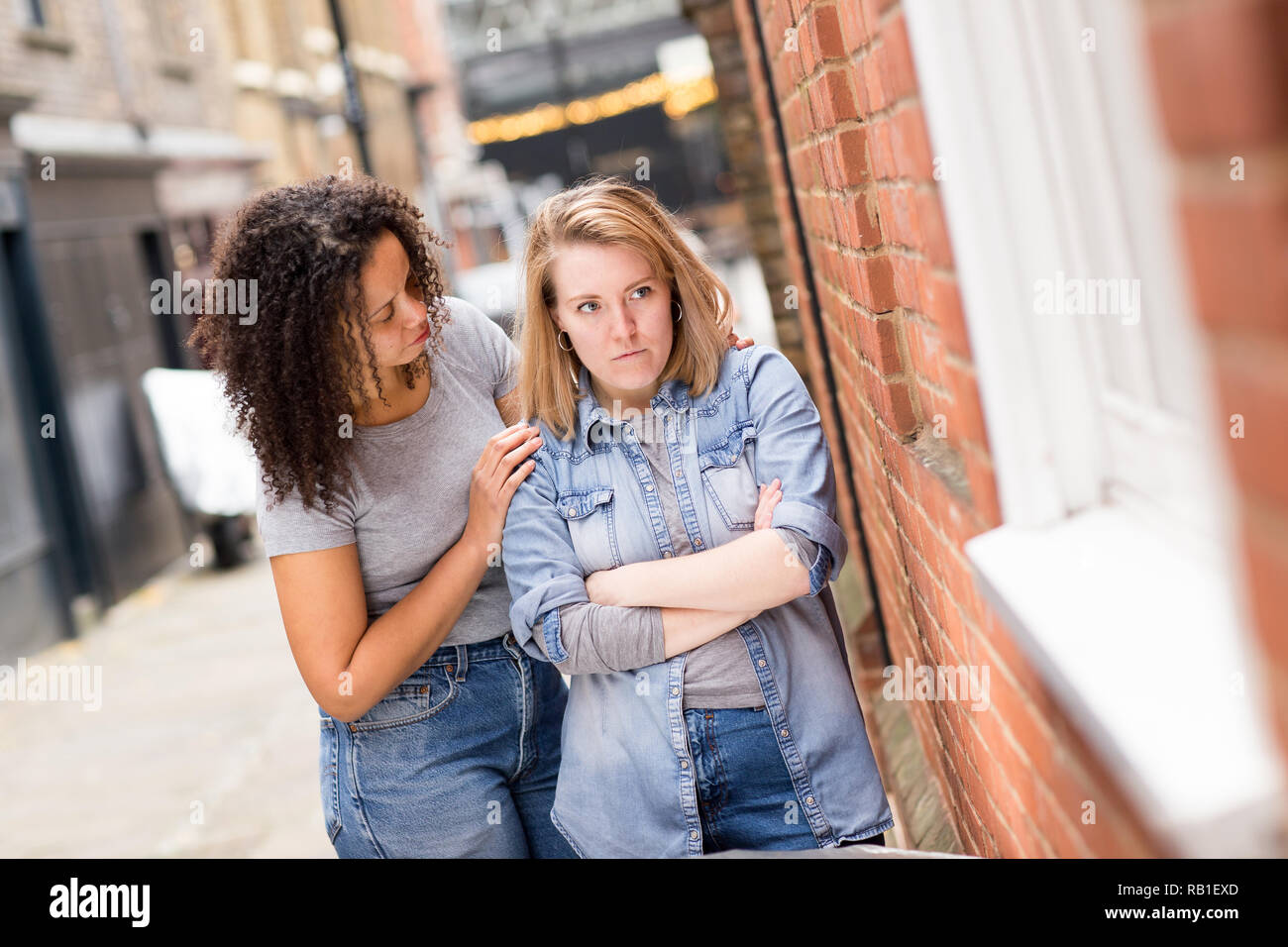 lesbian woman with her upset girlfriend Stock Photo - Alamy